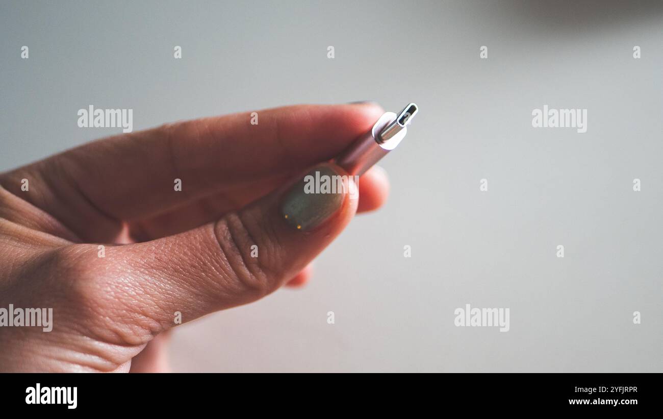 A hand holding usb plug c type close up minimalist technology Stock ...