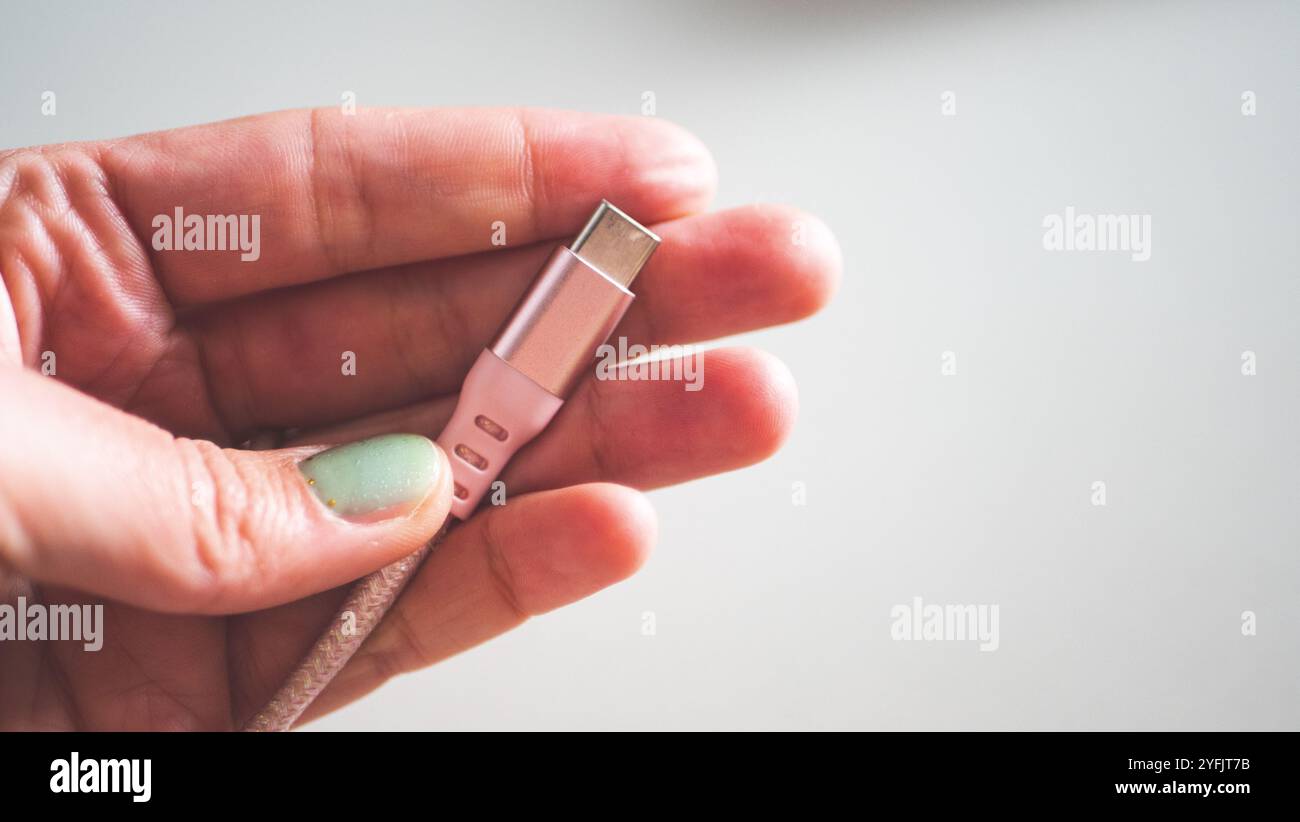 A hand holding usb plug c type close up minimalist technology Stock ...