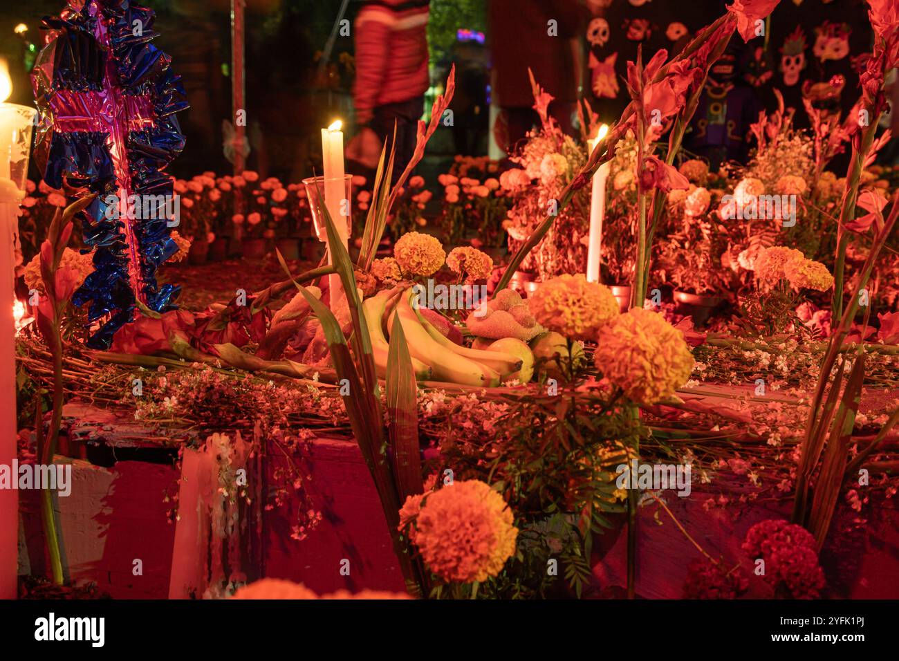 Dia de Muertos altar displaying traditional bread, marigolds, and ...