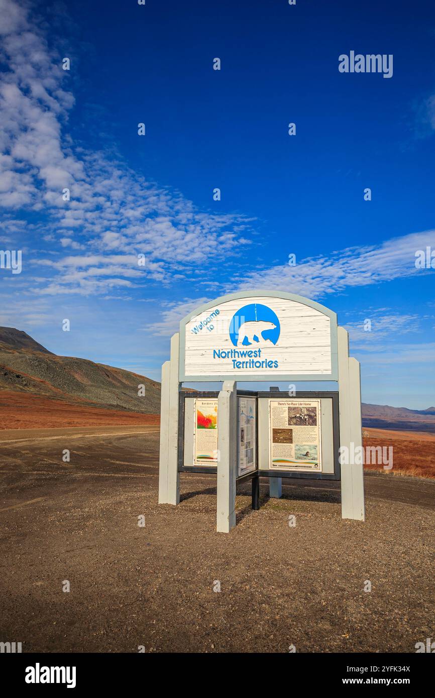 A sign at a roadside pullout on the Dempster Highway marking the Yukon ...