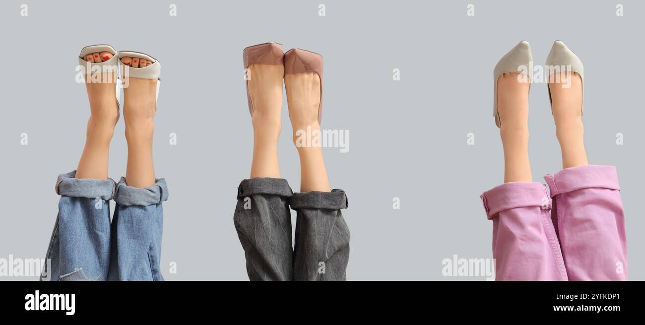 Legs of women in different high heels on grey background Stock Photo ...