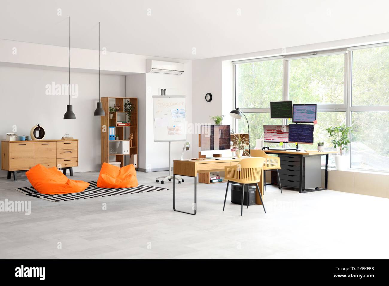 Interior of light programmer's office with desks and beanbags Stock ...