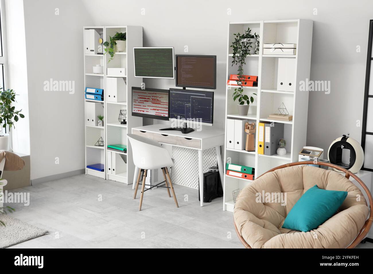 Interior of light programmer's office with workplace, shelf units and ...