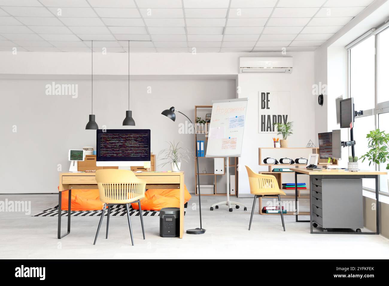 Interior of light programmer's office with desks and beanbags Stock ...