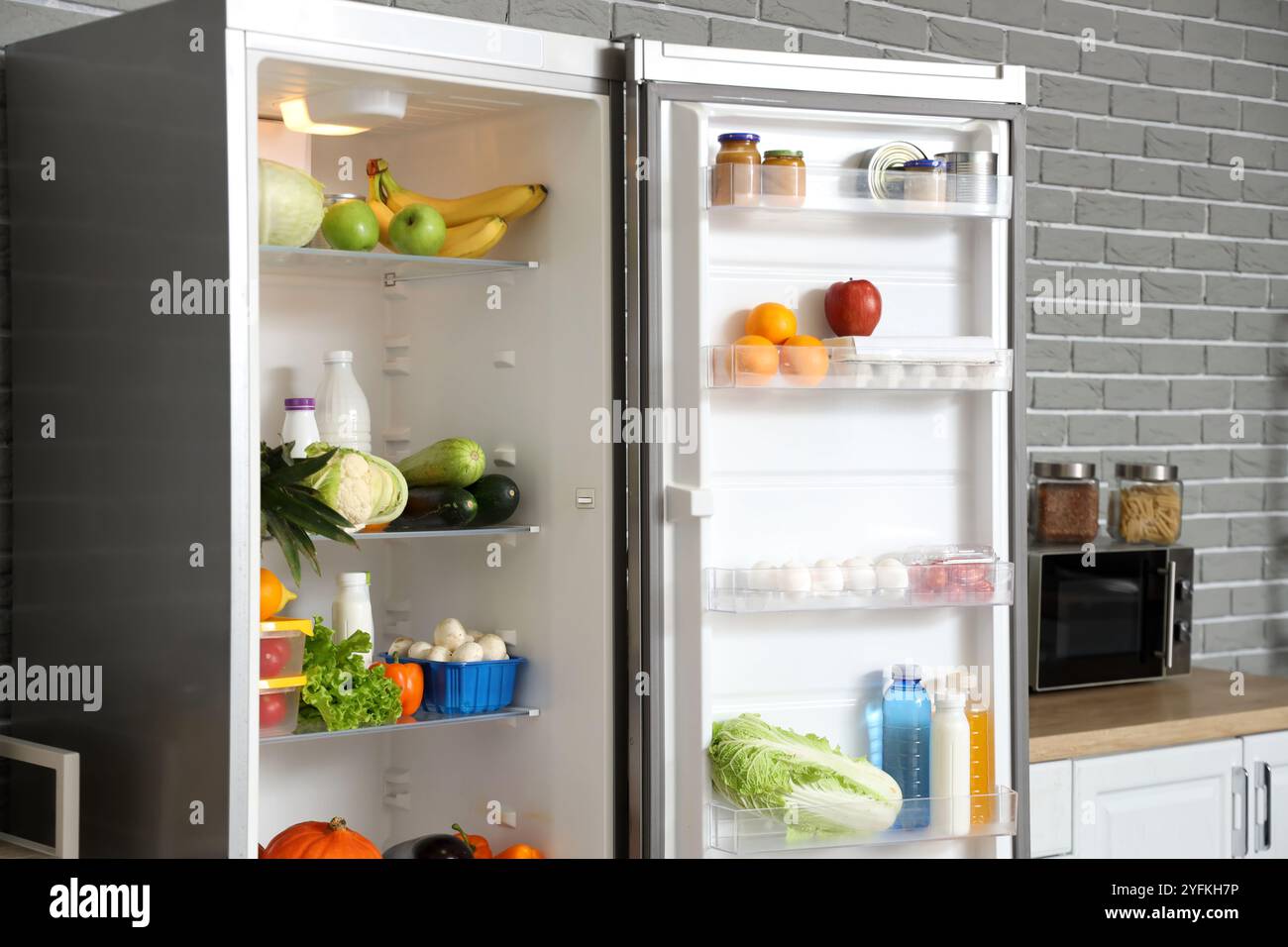 Open fridge with products in kitchen Stock Photo - Alamy