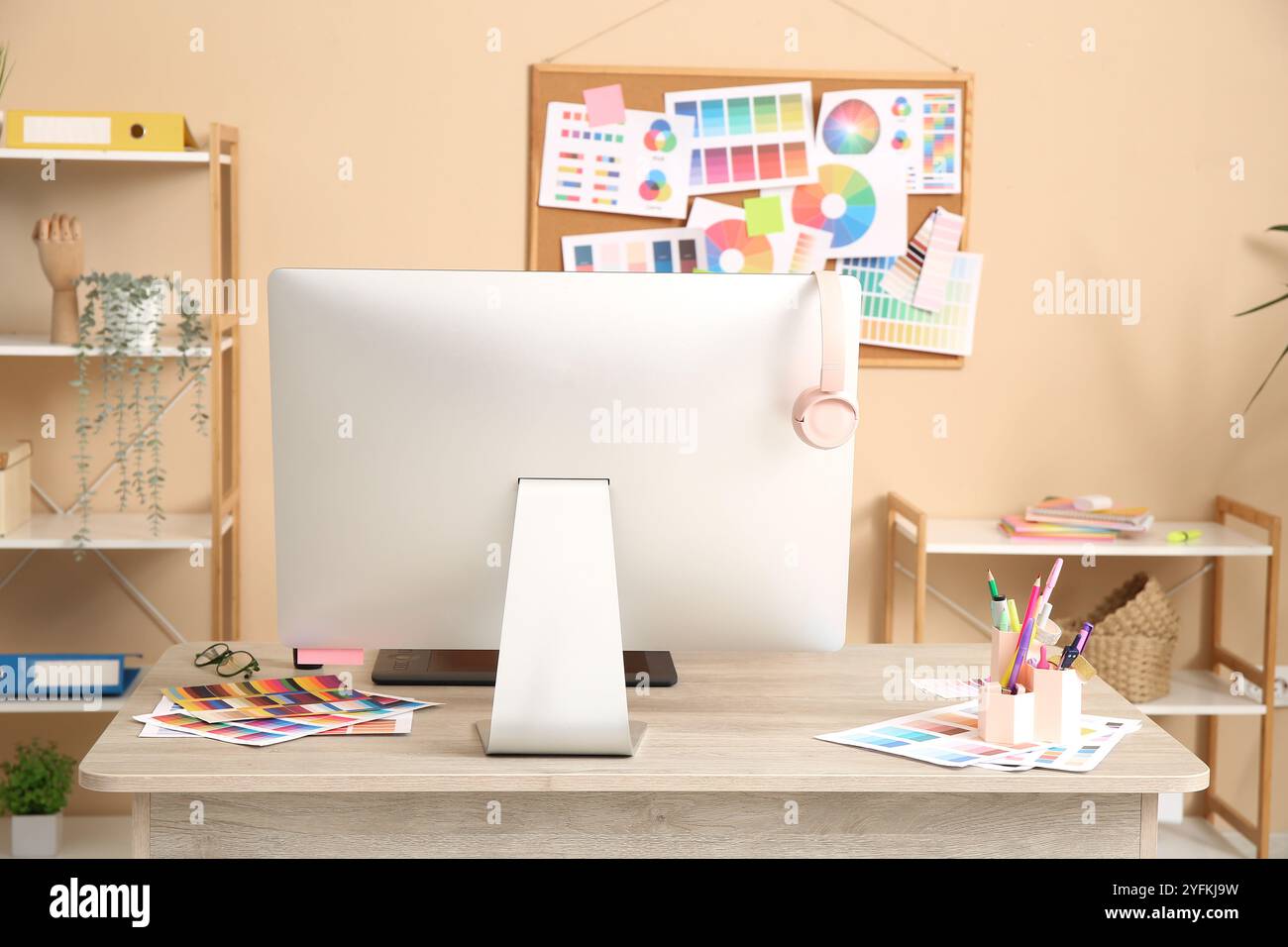 Designer's workplace with computer and color palettes in office Stock ...
