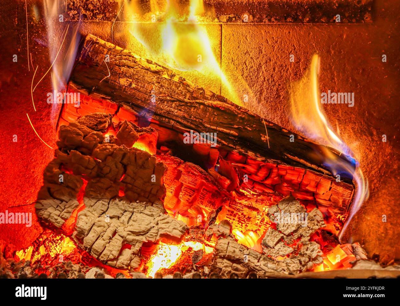 Big logs are burning in the stove Stock Photo - Alamy