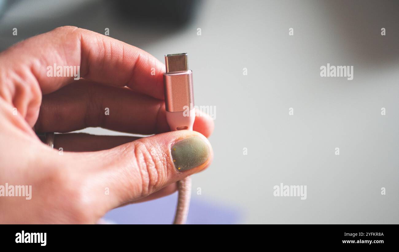 A hand holding usb plug c type close up minimalist technology Stock ...