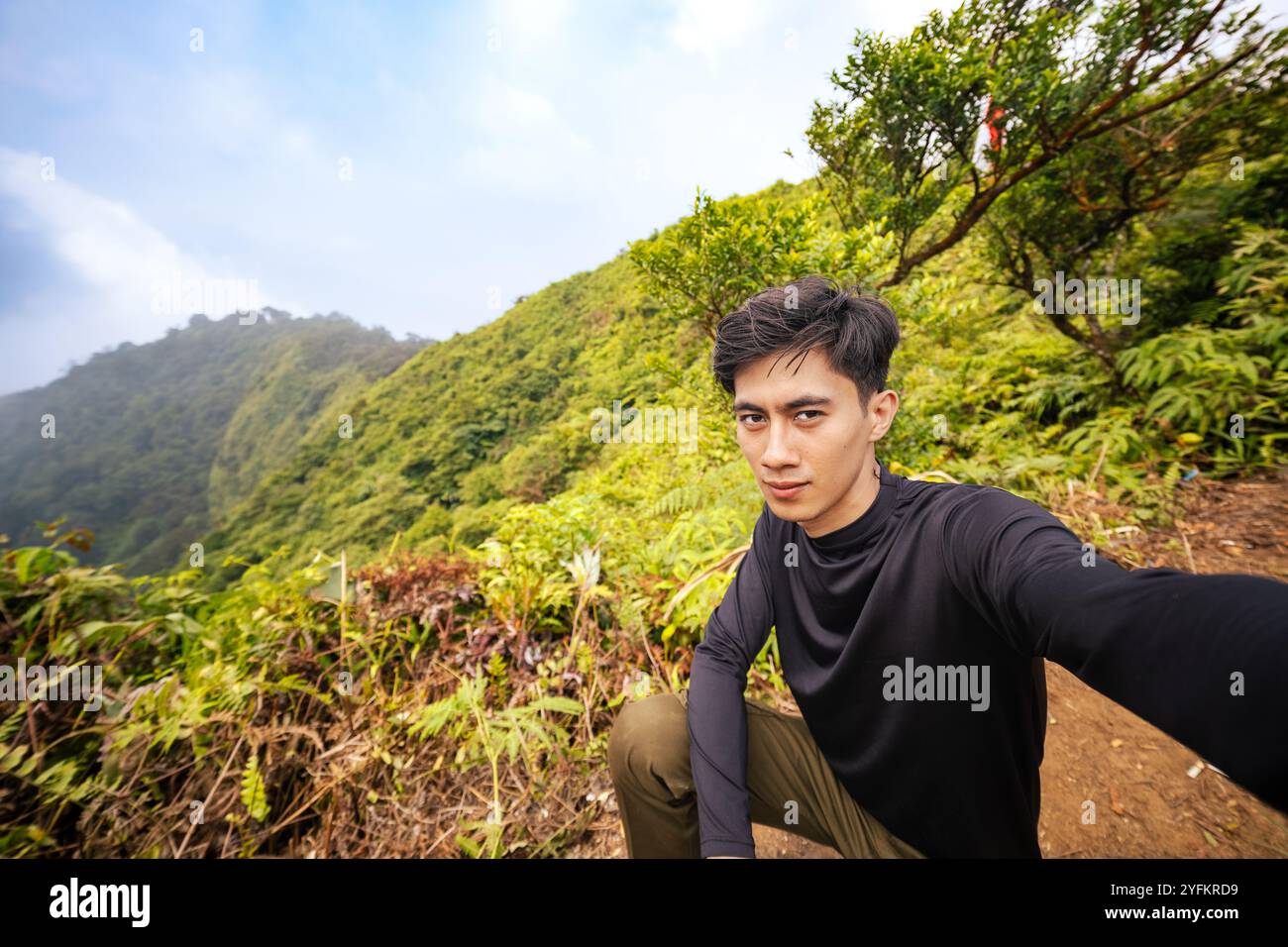 Man in the Wilderness, Posing Proudly on Mountain Peak. Serene Nature ...