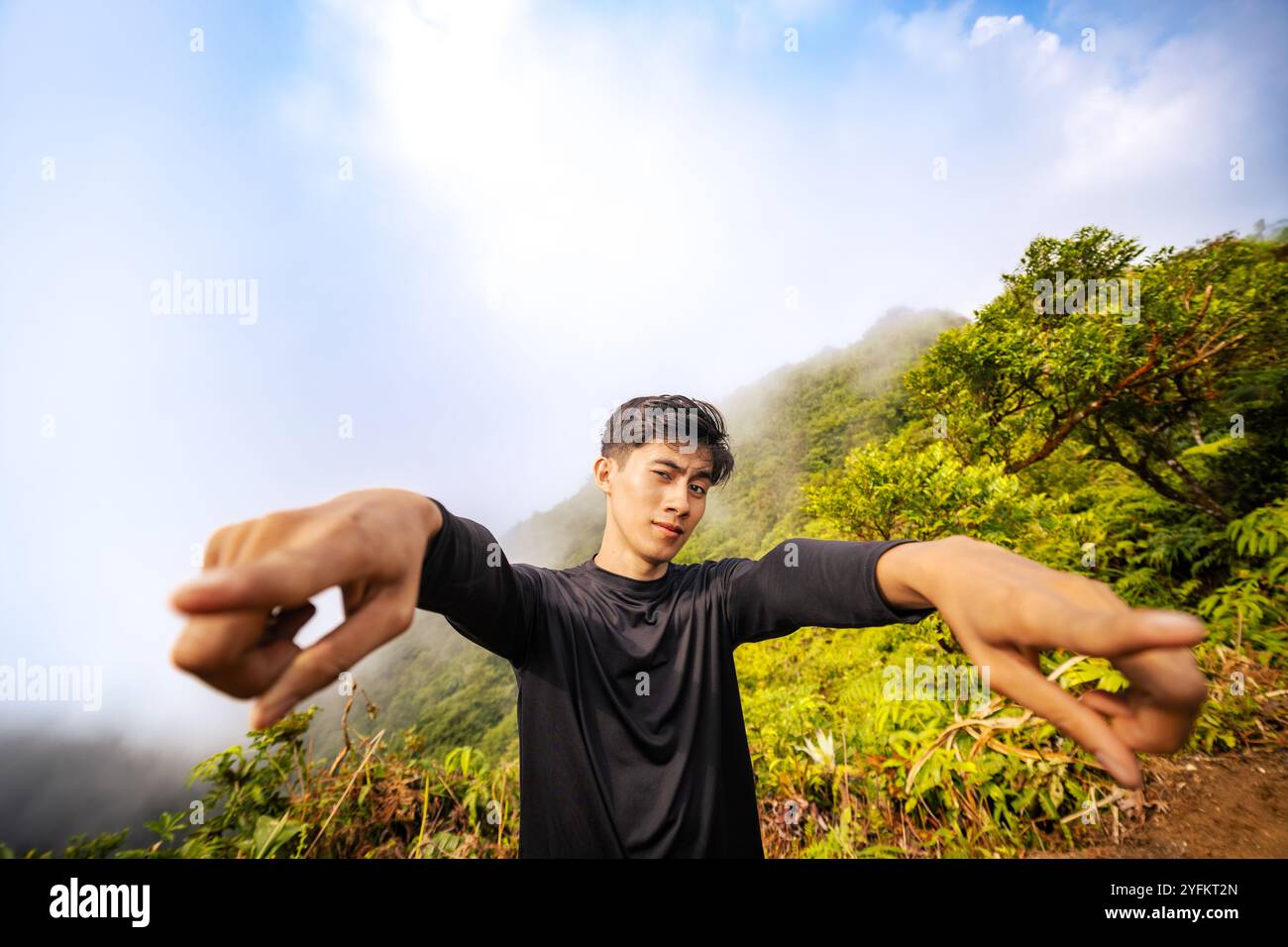 Positive young man pointing viewer hi-res stock photography and images ...
