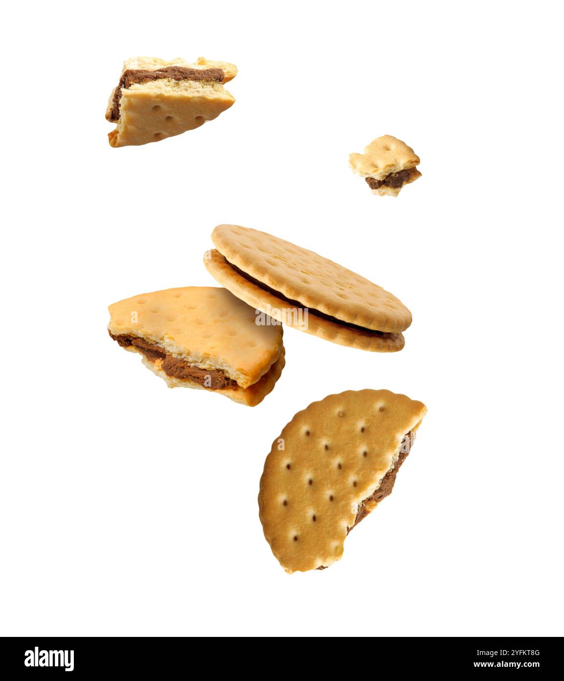 Tasty broken sandwich cookies in air on white background Stock Photo ...