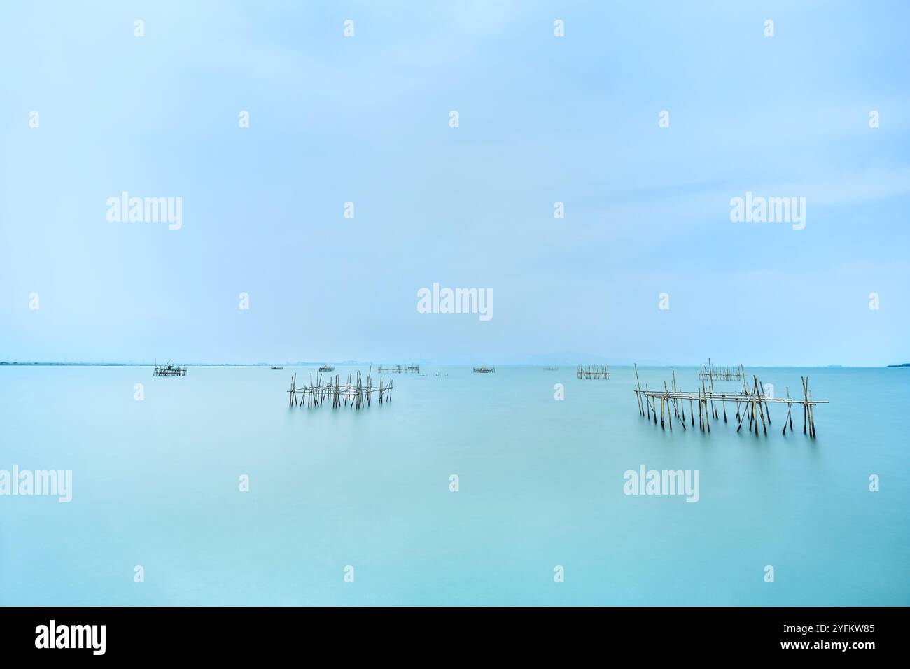 Minimalist photo of traditional fish trap known as Bagan in clear ...