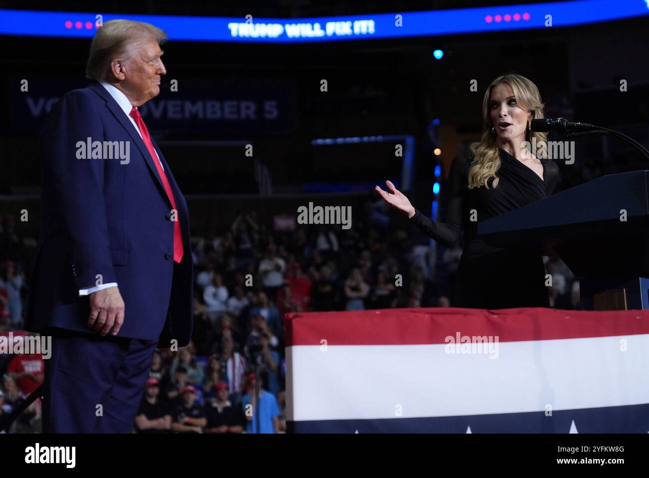 Republican presidential nominee former President Donald Trump listens ...