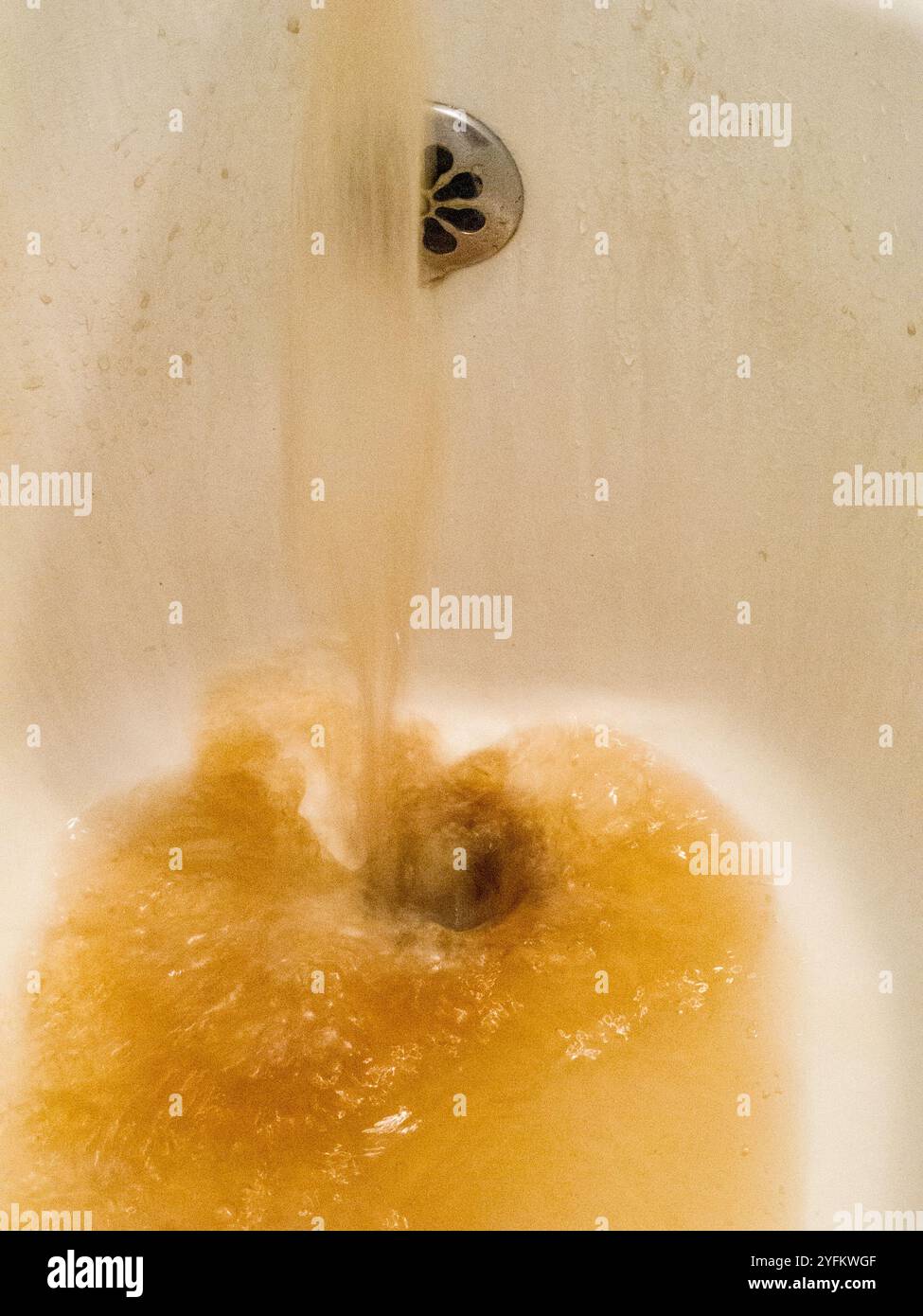 Dirty Tap Water Pouring from Bath tub Faucet Stock Photo - Alamy
