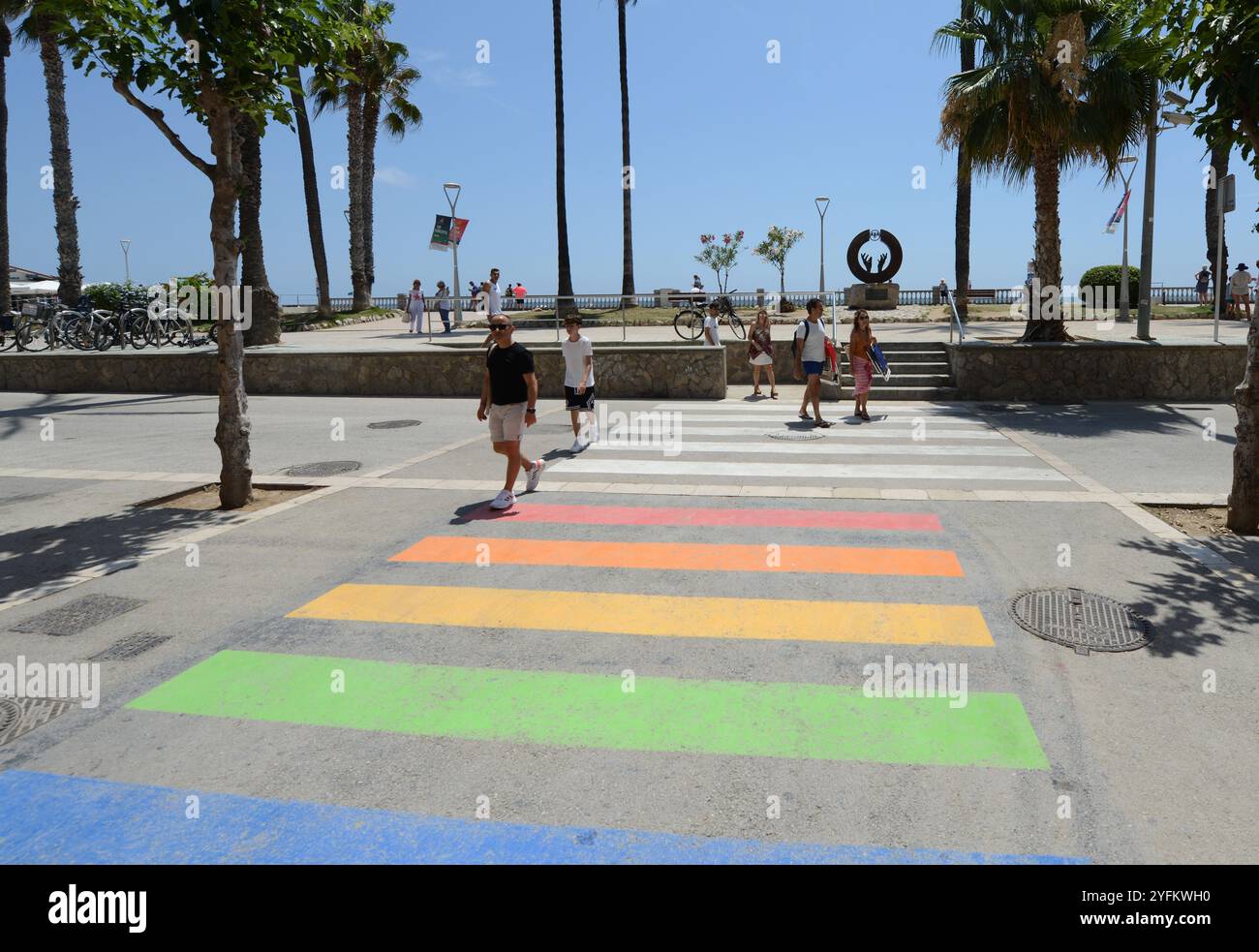 The rainbow pedestrian crossing at the waterfront in Sitges, Catalonia ...