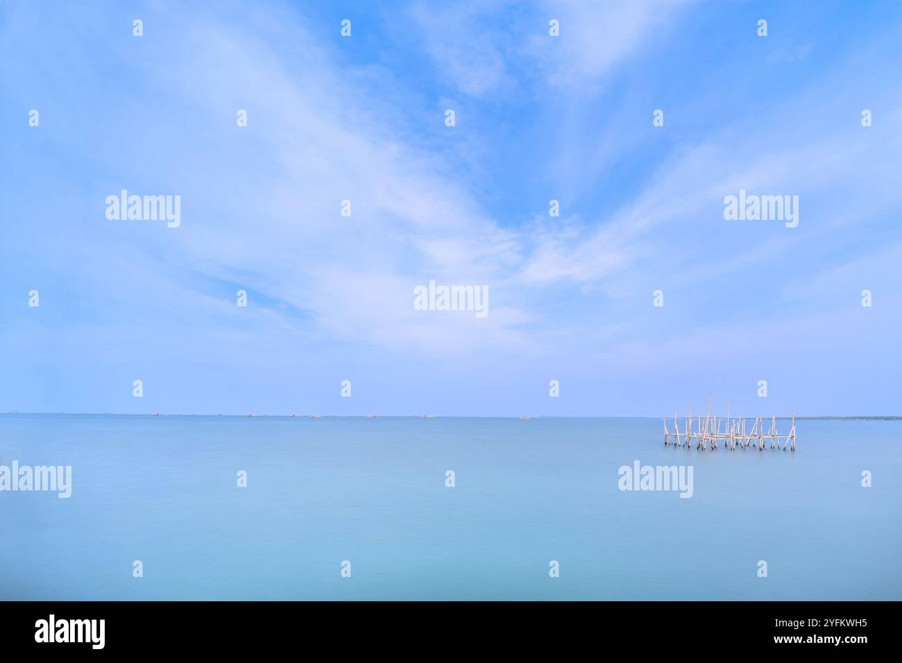 Serenity at Sea: Traditional Bamboo Fishing Raft. Expansive Blue Ocean ...