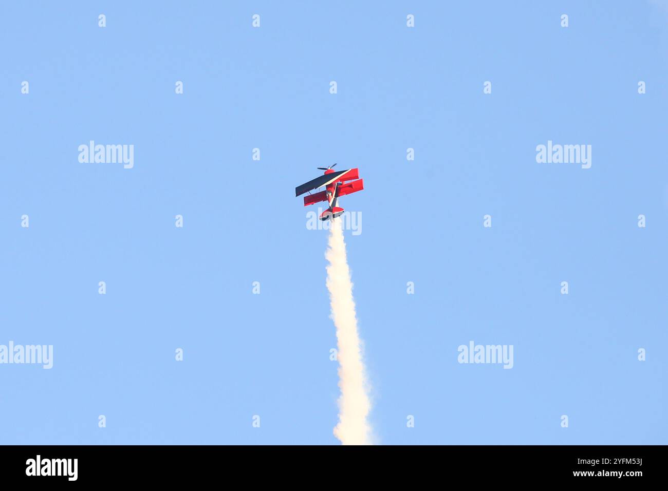 A plane is performing smoke stunt flying in the air. Nanchang,China.3rd ...