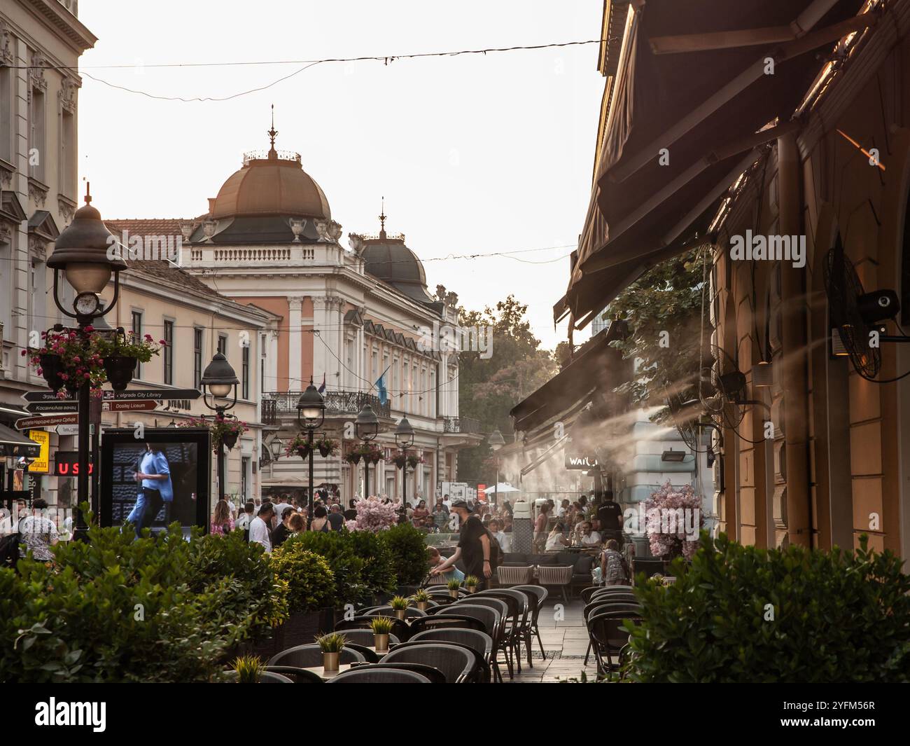 BELGRADE, SERBIA - JULY 16, 2024: Water sprays from terrace misting ...