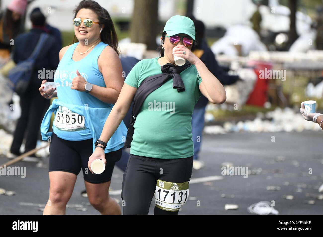 Running marathon reaching water hi-res stock photography and images - Alamy