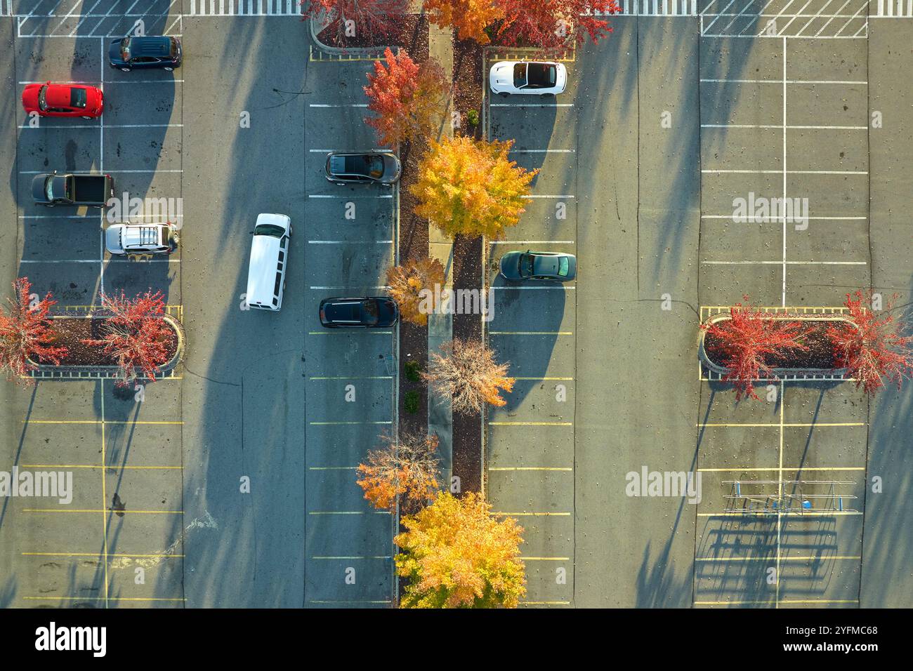 Aerial view of large parking lot with many parked colorful cars ...