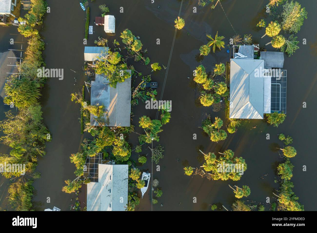 Aftermath of natural disaster. Flooded houses by hurricane Ian rainfall ...