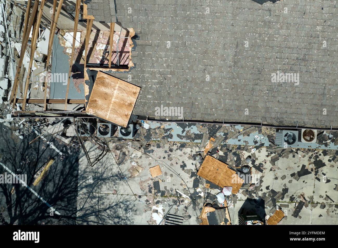 Ruined rooftop in need of repair. Wind damaged house roof with missing ...