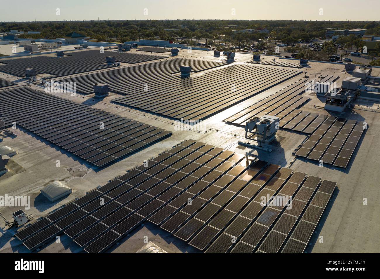 Aerial view of blue photovoltaic solar panels mounted on industrial ...