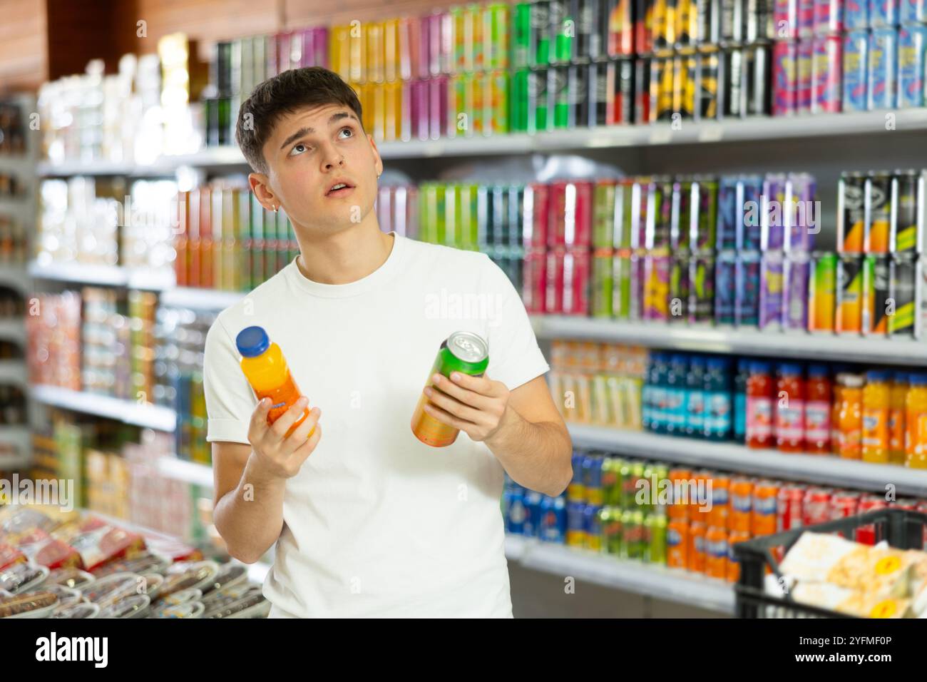 Guy reading labels bottles hi-res stock photography and images - Alamy