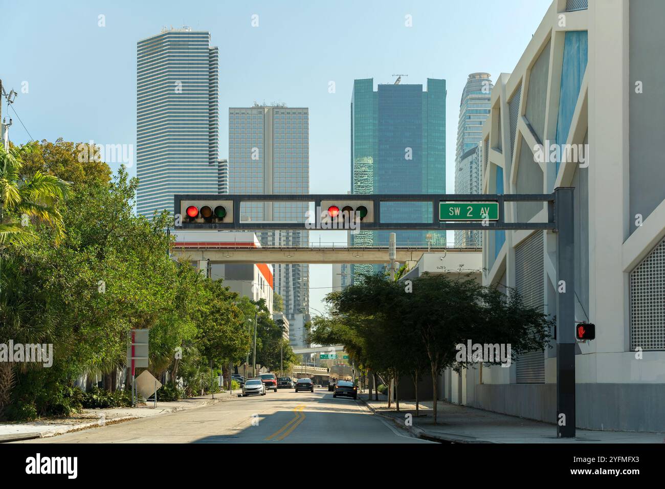 Traffic lights regulating driving cars on city street in Miami, Florida ...