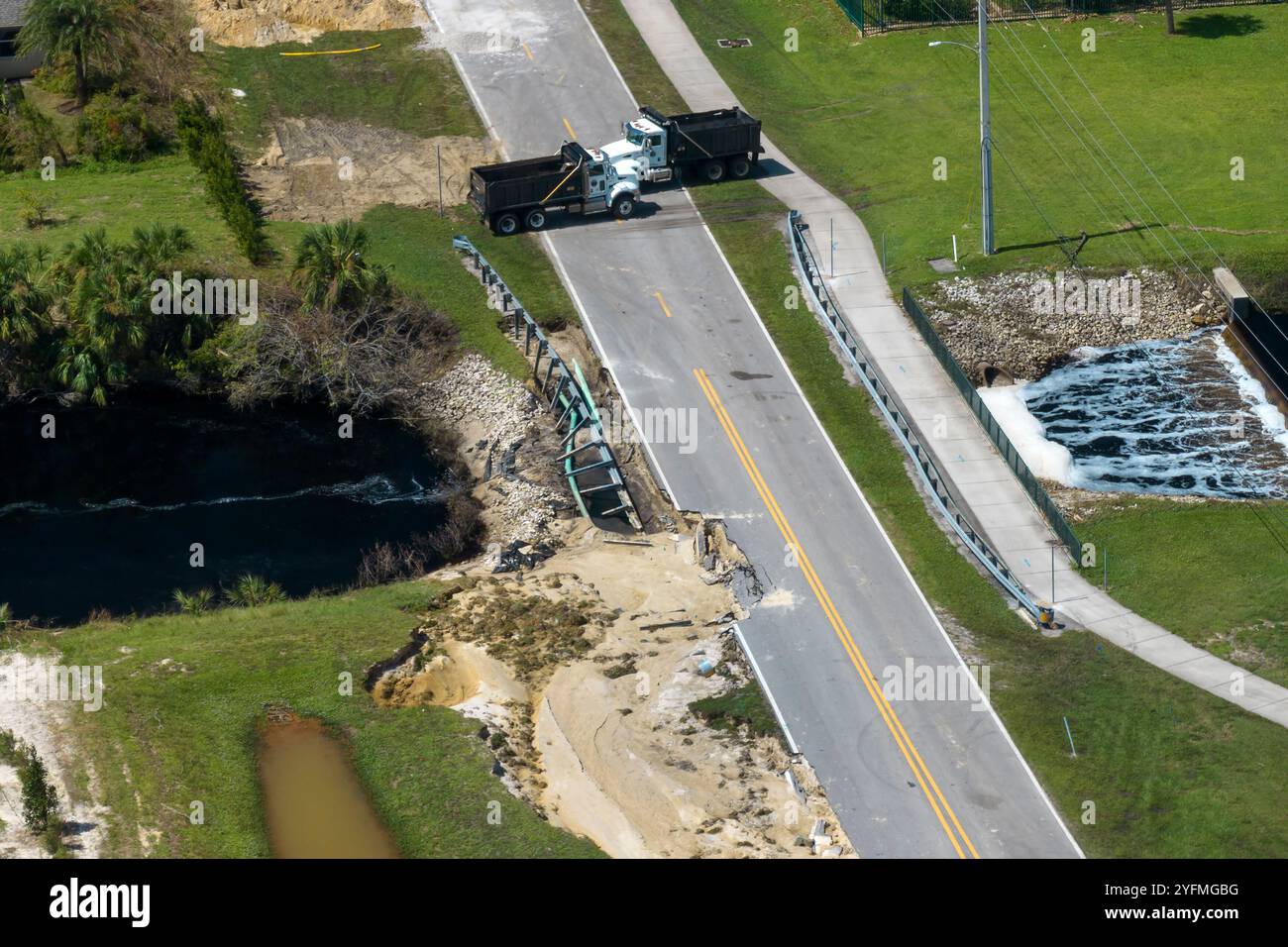 Roadblock at damaged road bridge destroyed by river after flood water ...