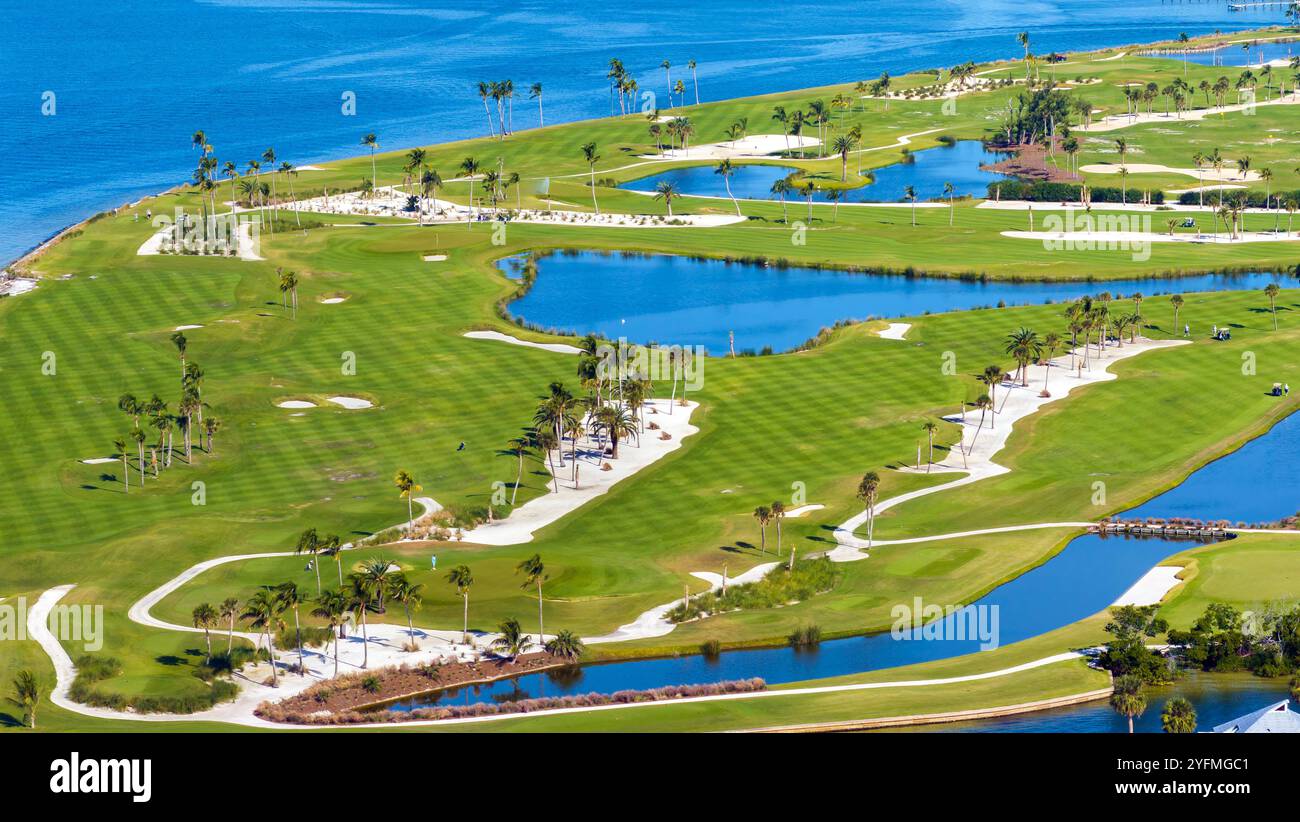 Aerial view of large golf field with green grass in Boca Grande, small ...