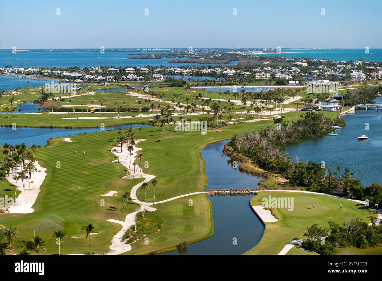 Waterfront golf course in Florida. Sports grounds with green grass in ...
