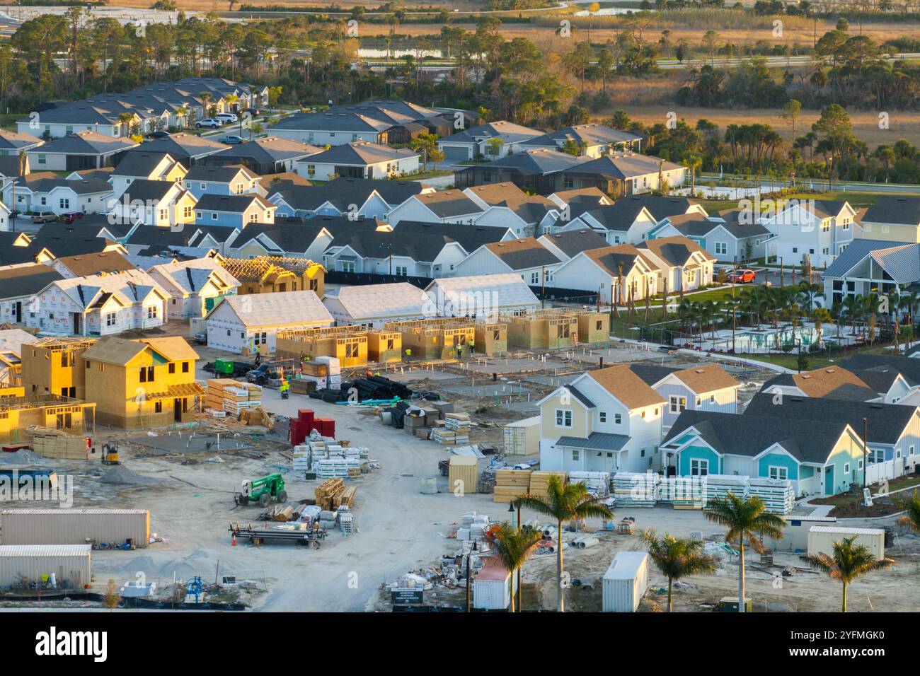 Wooden houses under construction in new developing suburban area ...
