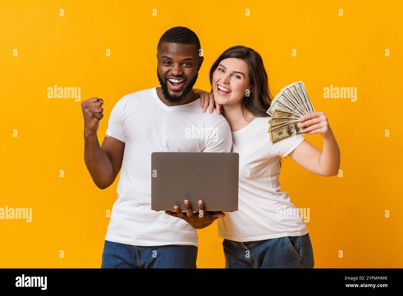 Overjoyed interracial couple celebrating hi-res stock photography and ...