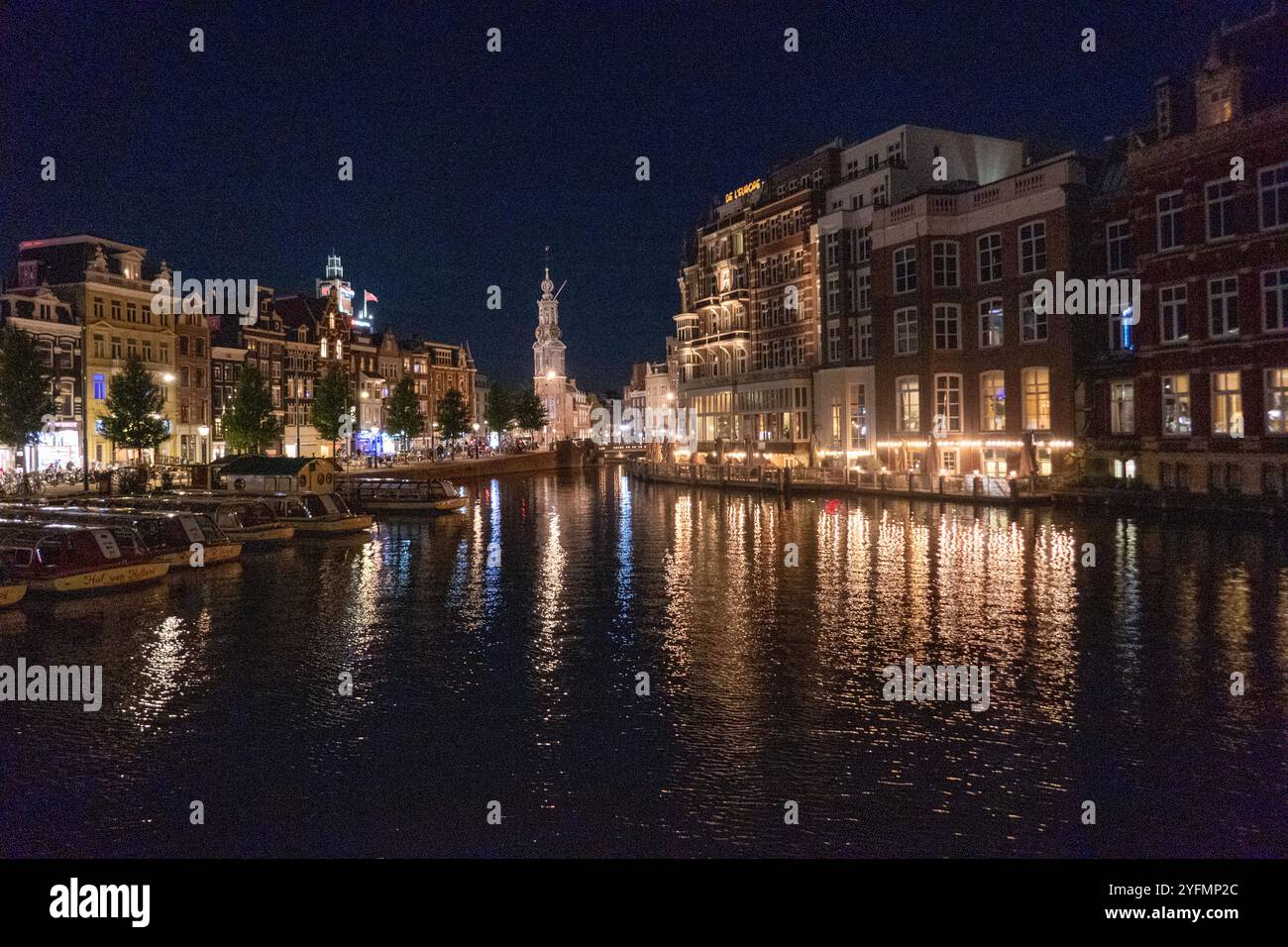 Amsterdam Canal at night reflections in water Stock Photo - Alamy