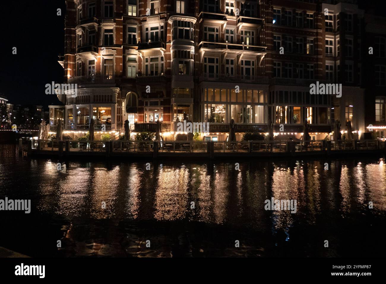 Amsterdam Canal at night reflections in water Stock Photo - Alamy