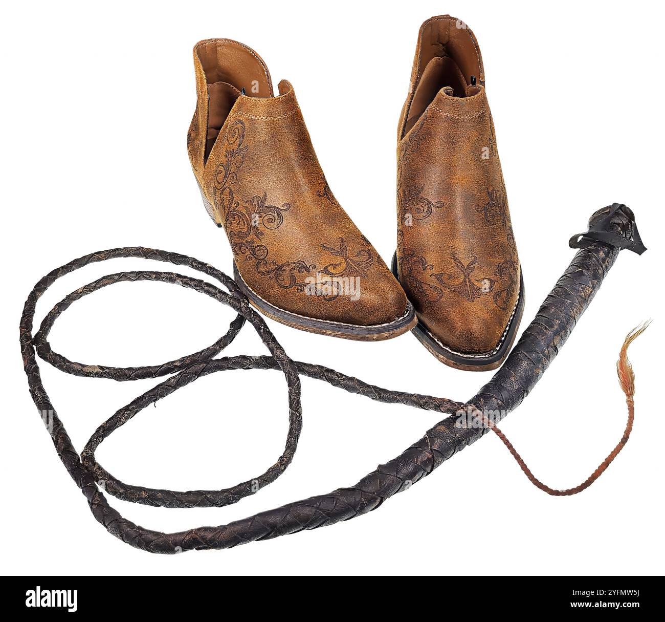 Brown boots with an embossed design with a whip coiled in front Stock ...