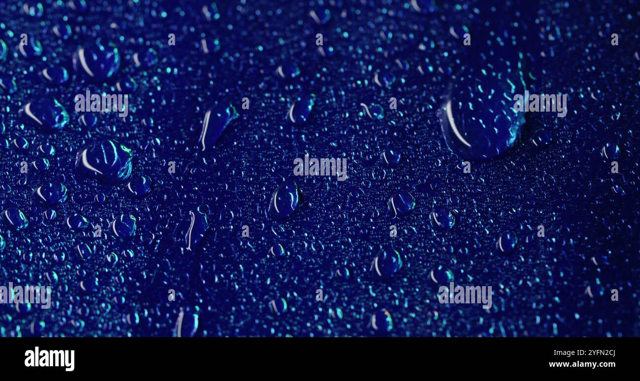Condensate flow. Blue droplet. Clean raindrops spill on smooth wet ...