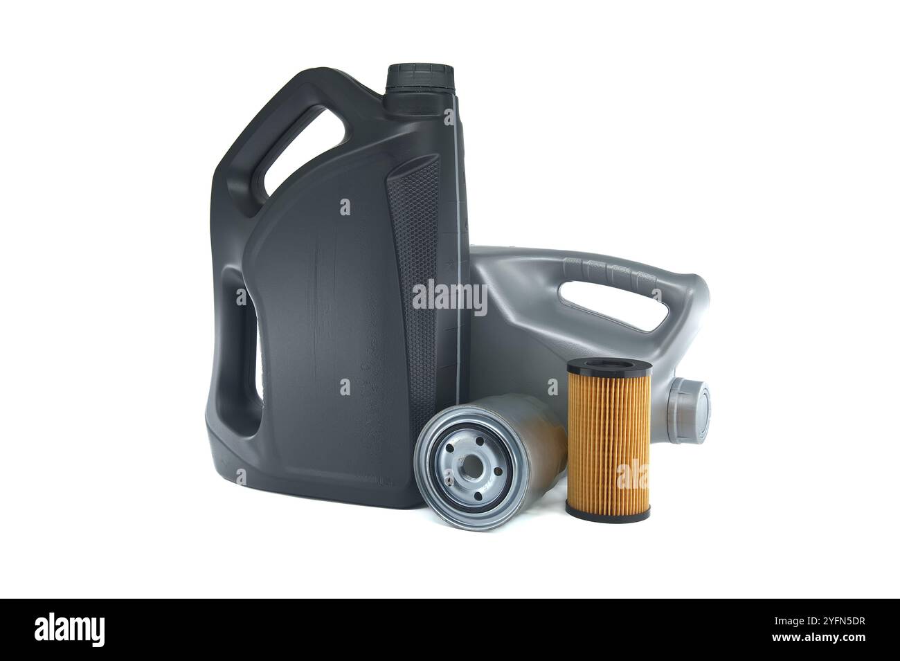 Two oil containers and automotive filters are displayed on a white ...