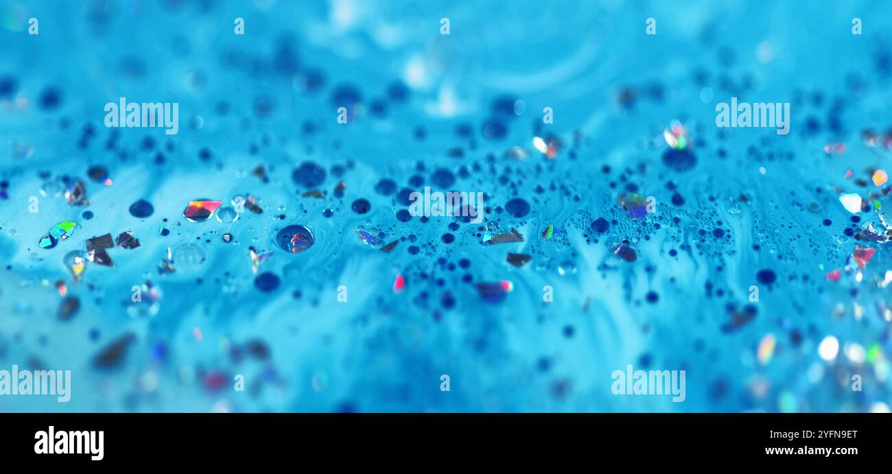 Color ink spill. Shiny oil bubbles. Defocused blue color sparkling ...