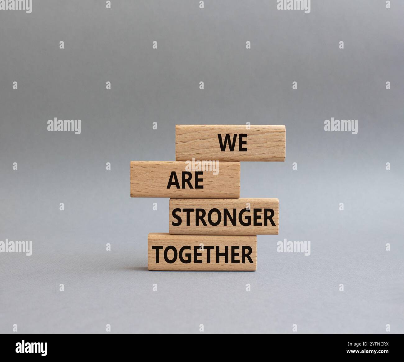We are stronger together symbol. Wooden blocks with words We are ...
