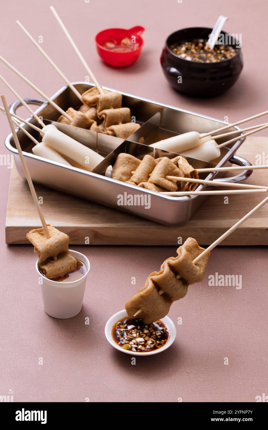 Various oden and soy sauce in a fish cake machine Stock Photo - Alamy