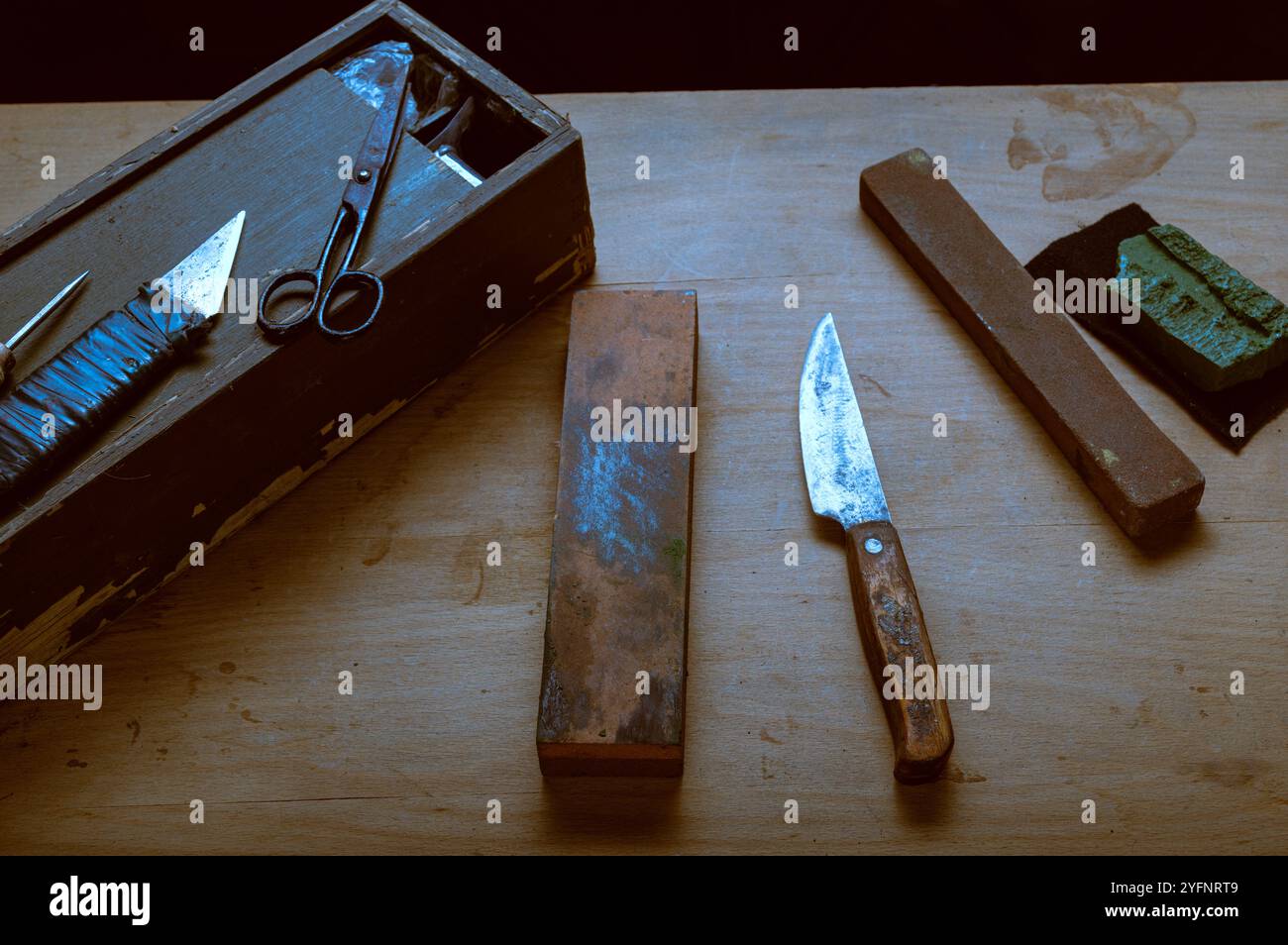 Craftsman's table. Old tools and knife. Toolbox. View from above Stock ...