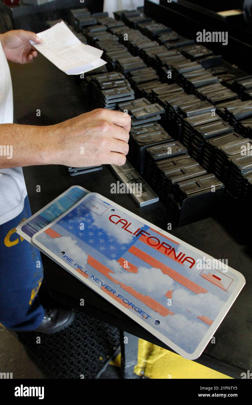 FILE - An inmate selects the letters and numbers to be used to make a ...