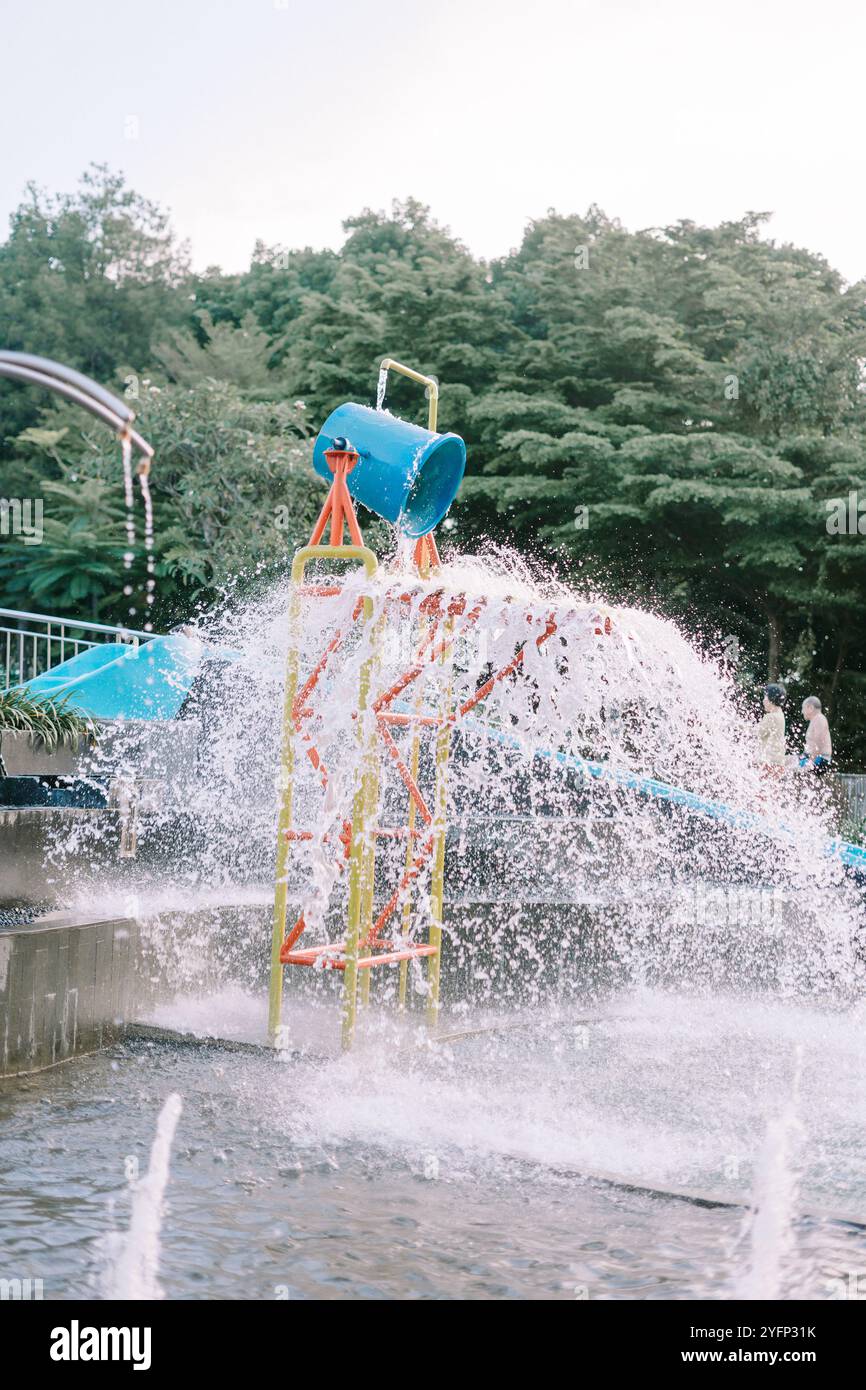 Bogor, October 26, 2024. Artificial waterfall pouring from a bucket ...