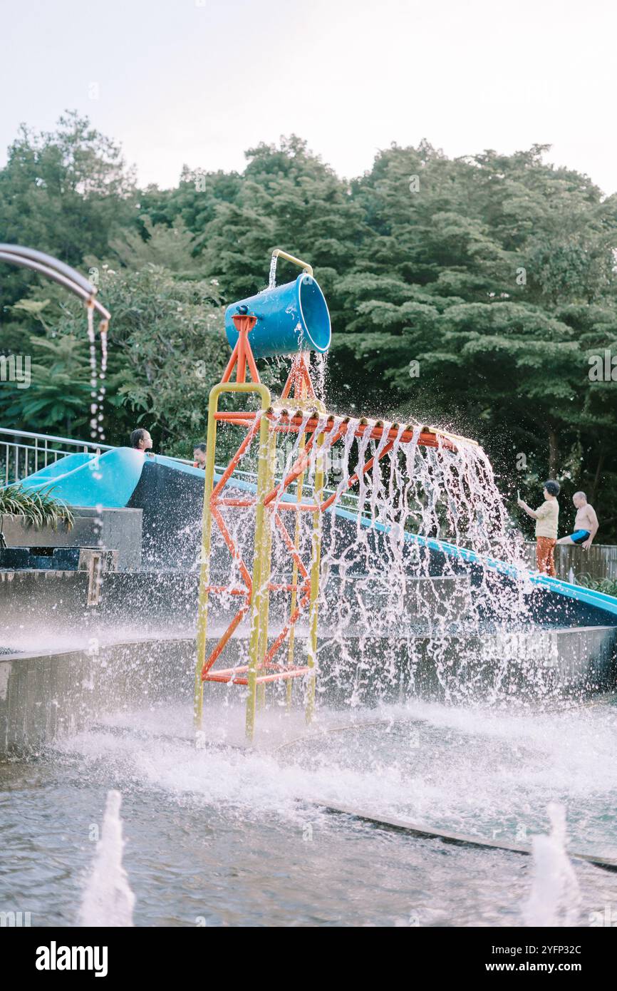 Bogor, October 26, 2024. Artificial waterfall pouring from a bucket ...