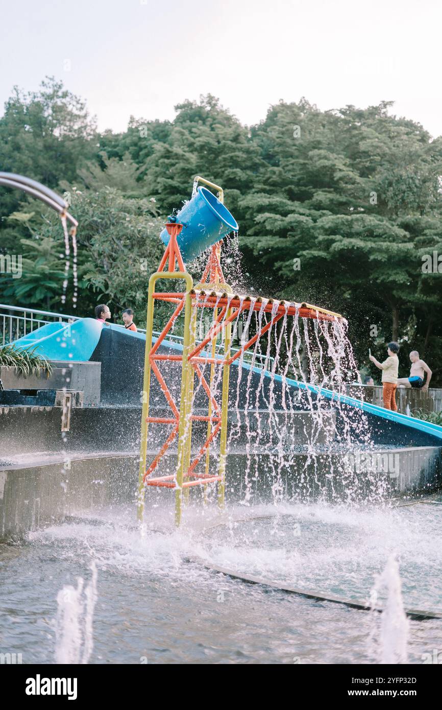 Bogor, October 26, 2024. Artificial waterfall pouring from a bucket ...