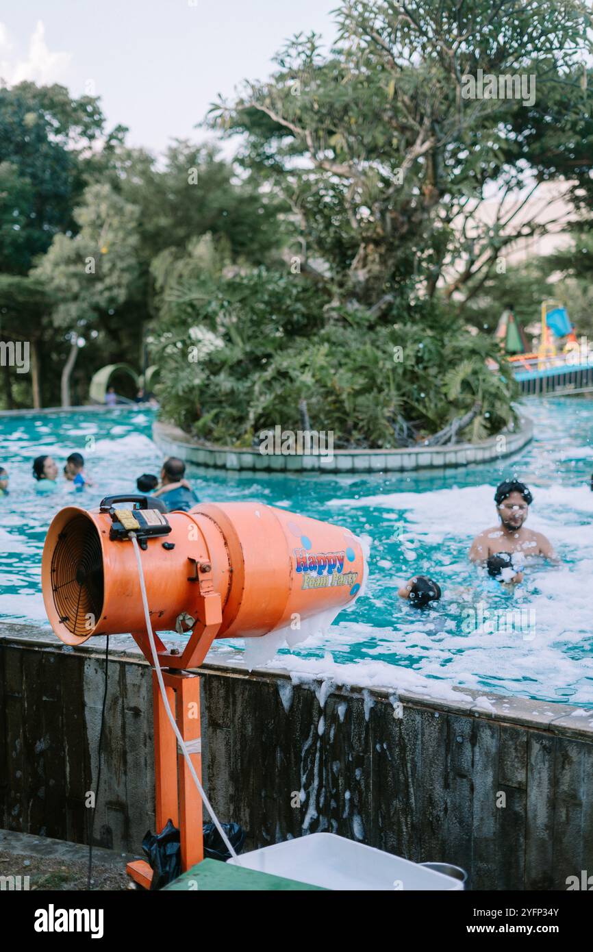 Bogor, October 26, 2024. Jet foam machine filling a public pool with ...