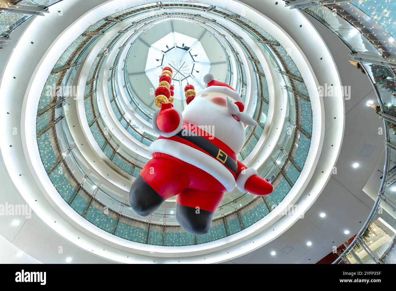Santa Claus doll and Christmas decorations at a shopping mall in Manila ...