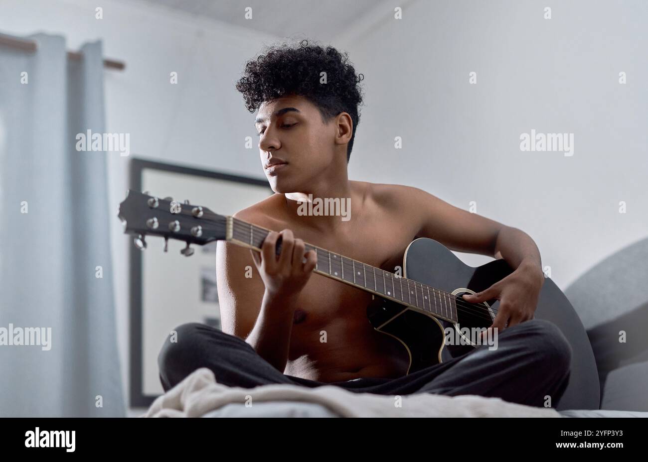 Guitar, creative and man in home playing music for learning chords ...